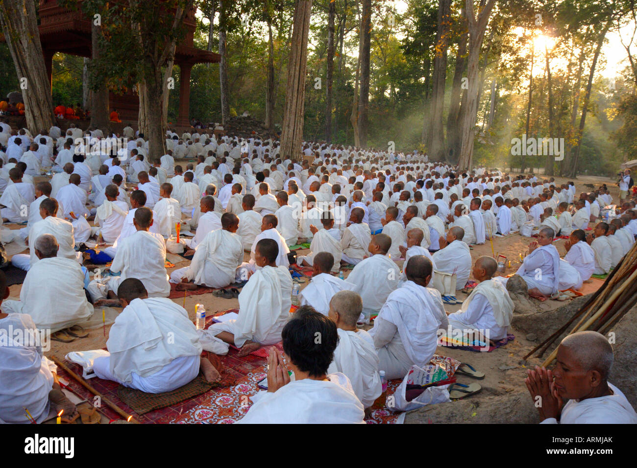 Buddhist monks and nuns gather for a ceremony for peace, Bayon temple ...