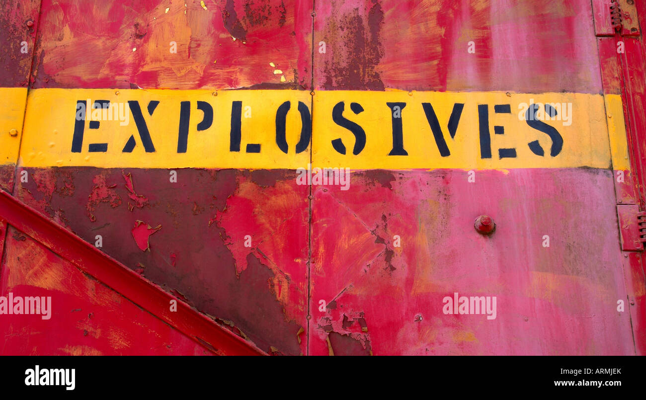 A bold explosive sign on the side of a train carriage Stock Photo - Alamy