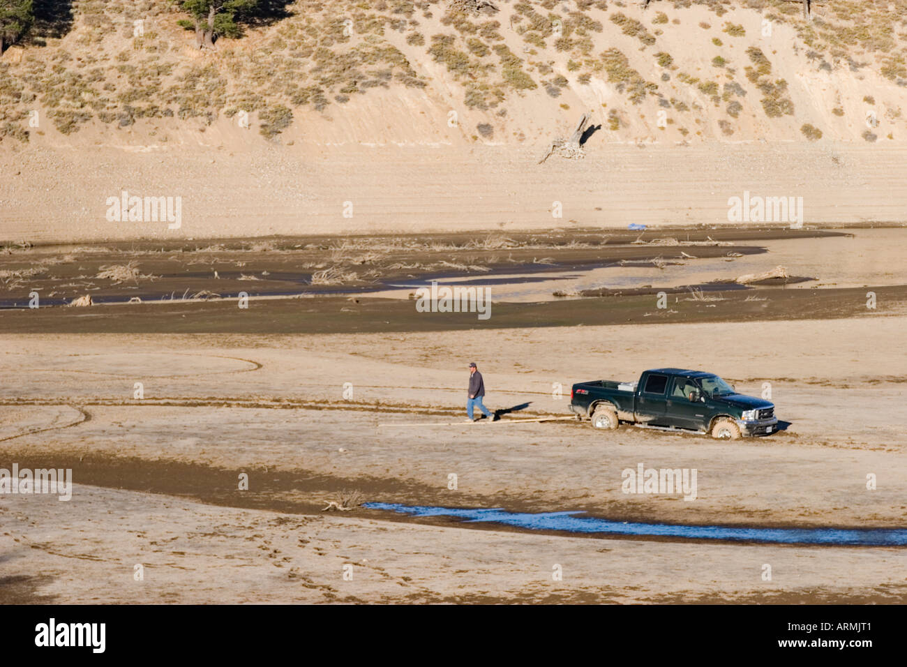 A pickup ruck gets stuck in the muddy lakebed at Prosser Reservoir ...