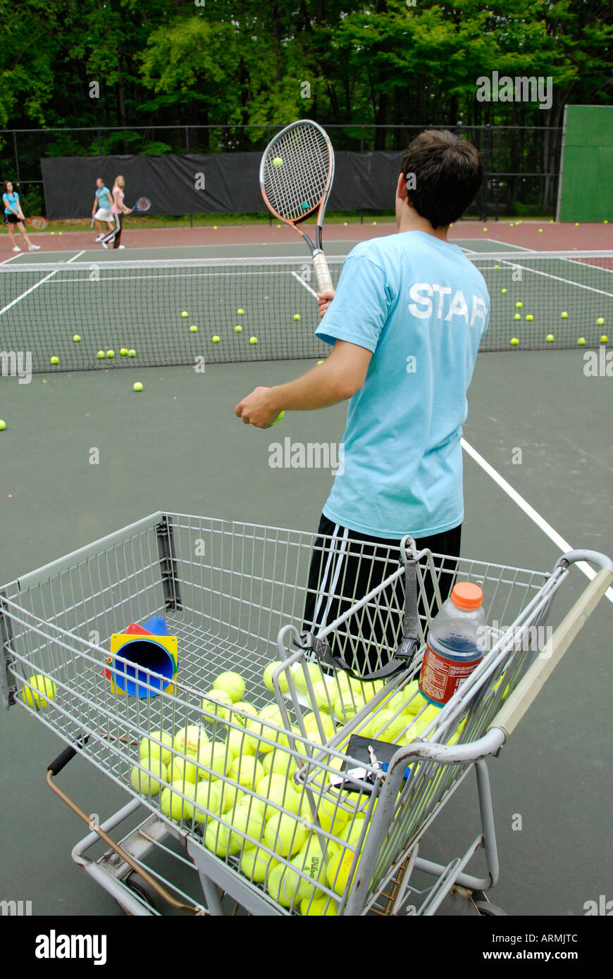 Middle school and high school age teenagers take Tennis lesson in a ...