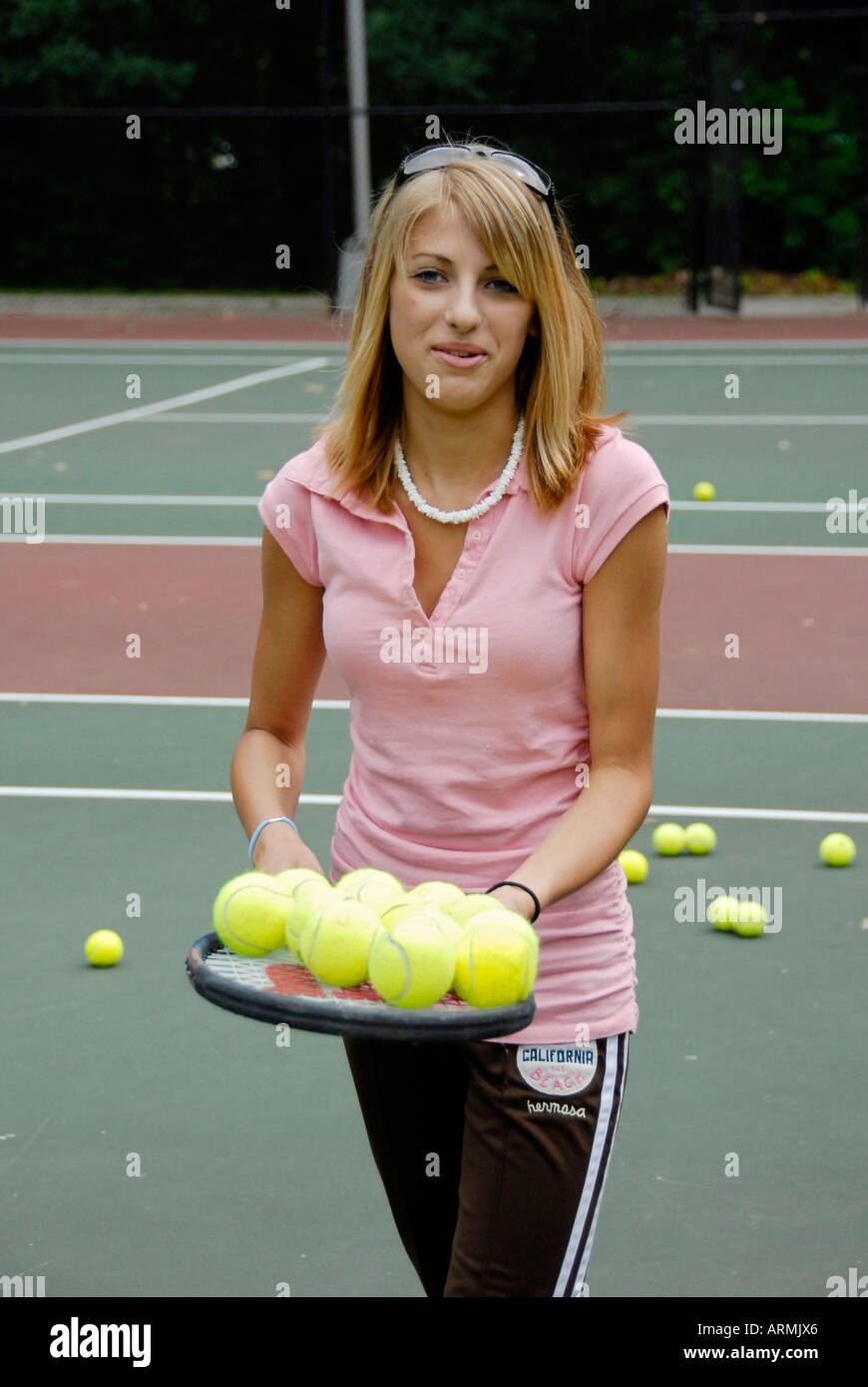 Middle school and high school age teenagers take Tennis lesson in a ...