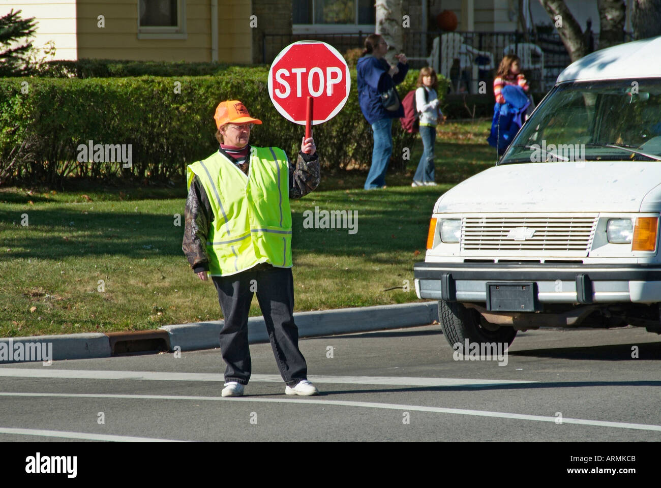 Elementary school crossing guard provides safety to children crossing ...