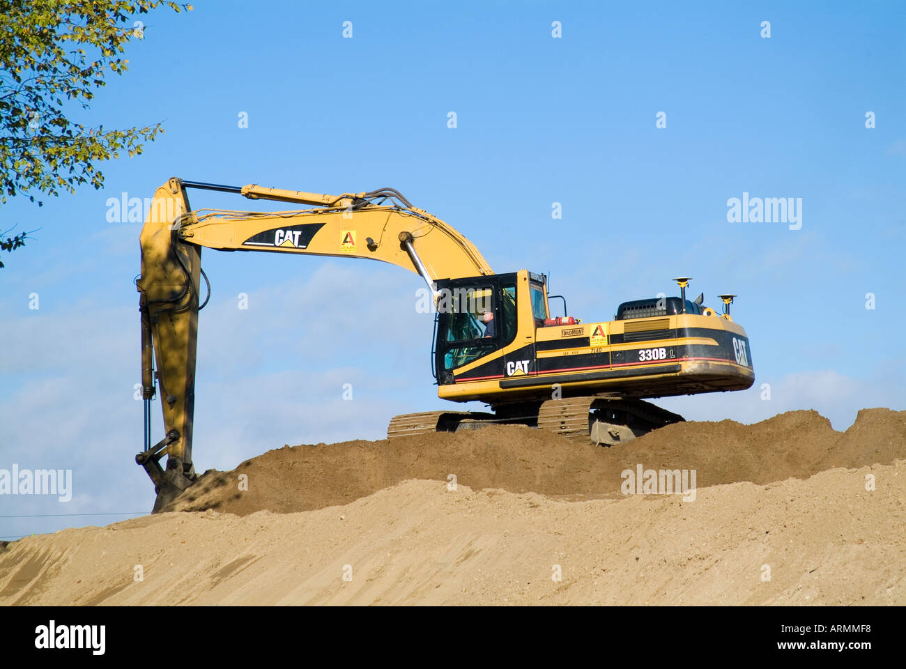 Heavy road construction building equipment work as a team to build a ...