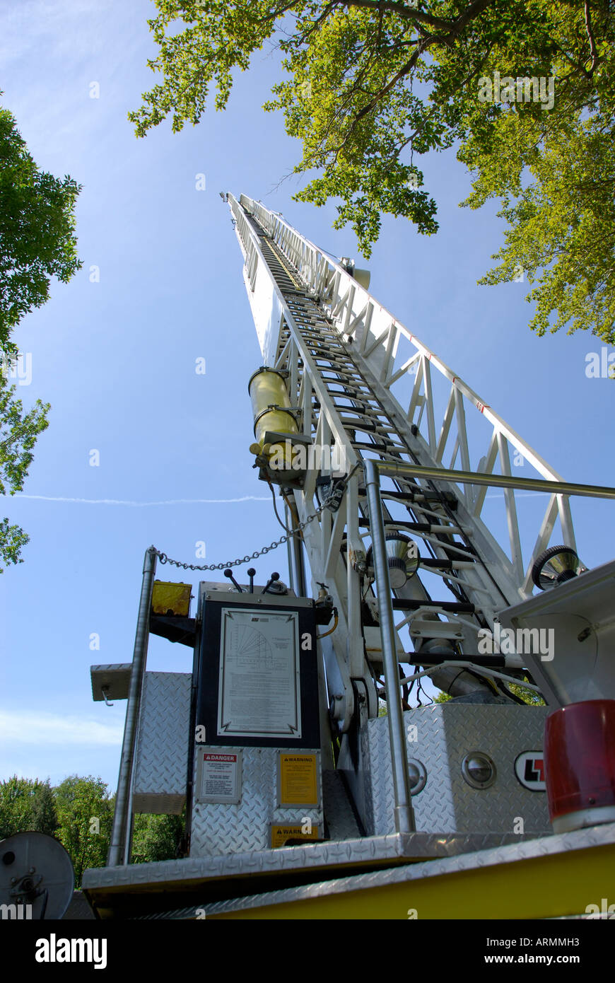 long and tall ladder on a fire truck shows various degrees of level and ...