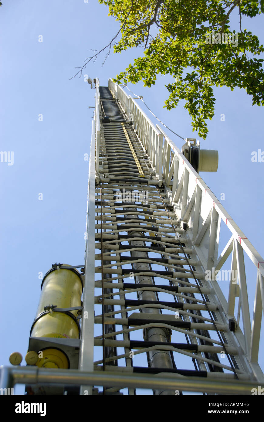 long and tall ladder on a fire truck shows various degrees of level and ...