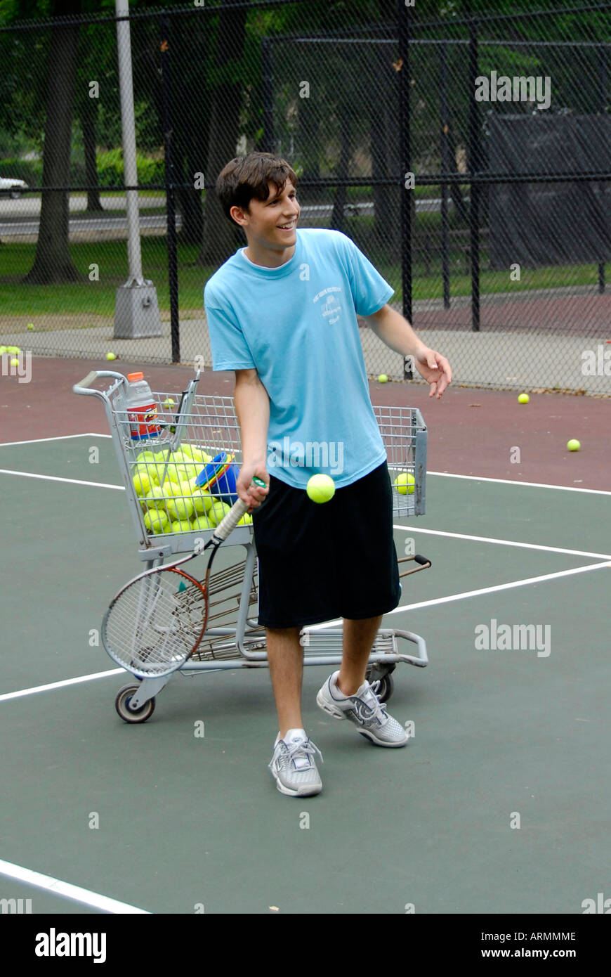 Middle school and high school age teenagers take Tennis lesson in a ...