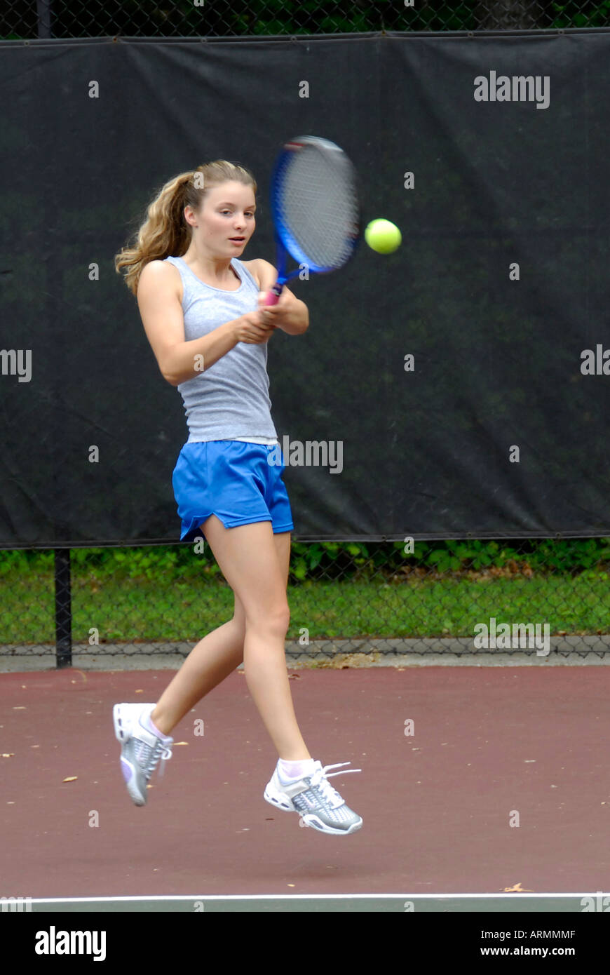 Middle school and high school age teenagers take Tennis lesson in a ...