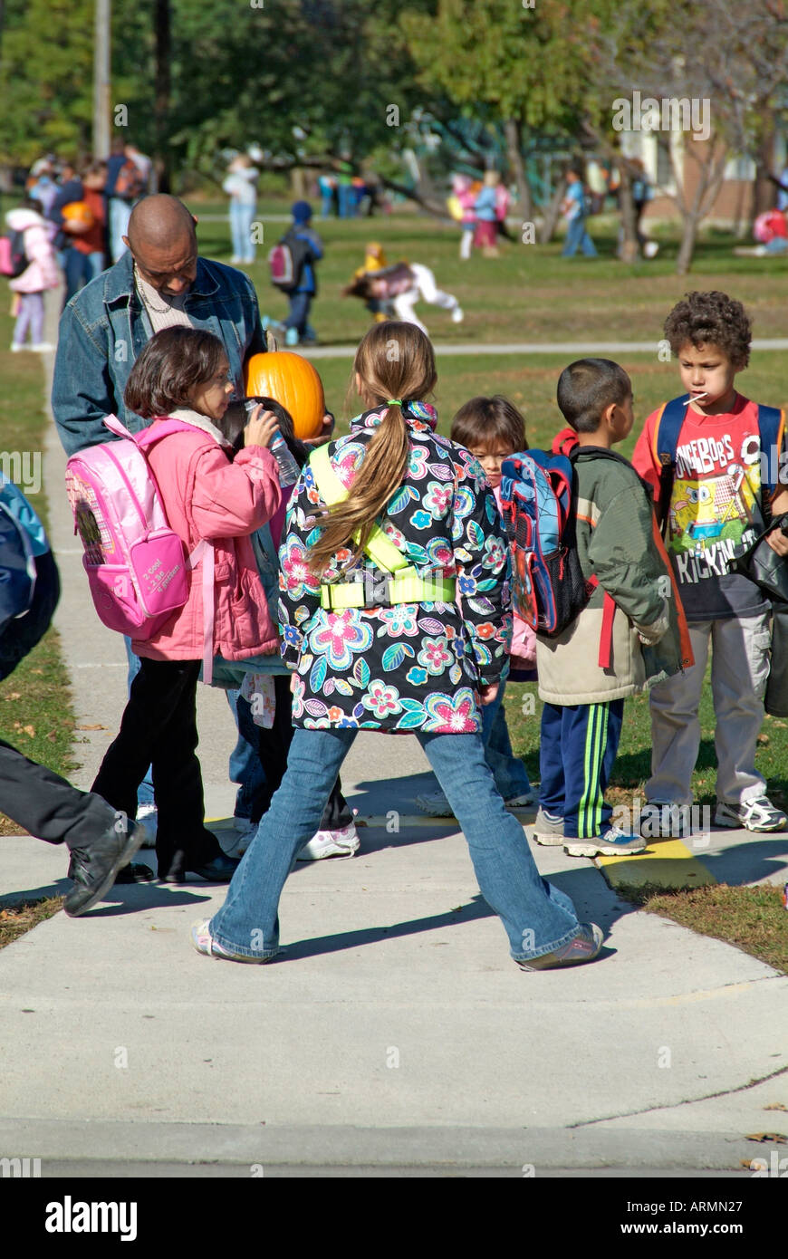 Elementary school crossing guard provides safety to children crossing ...