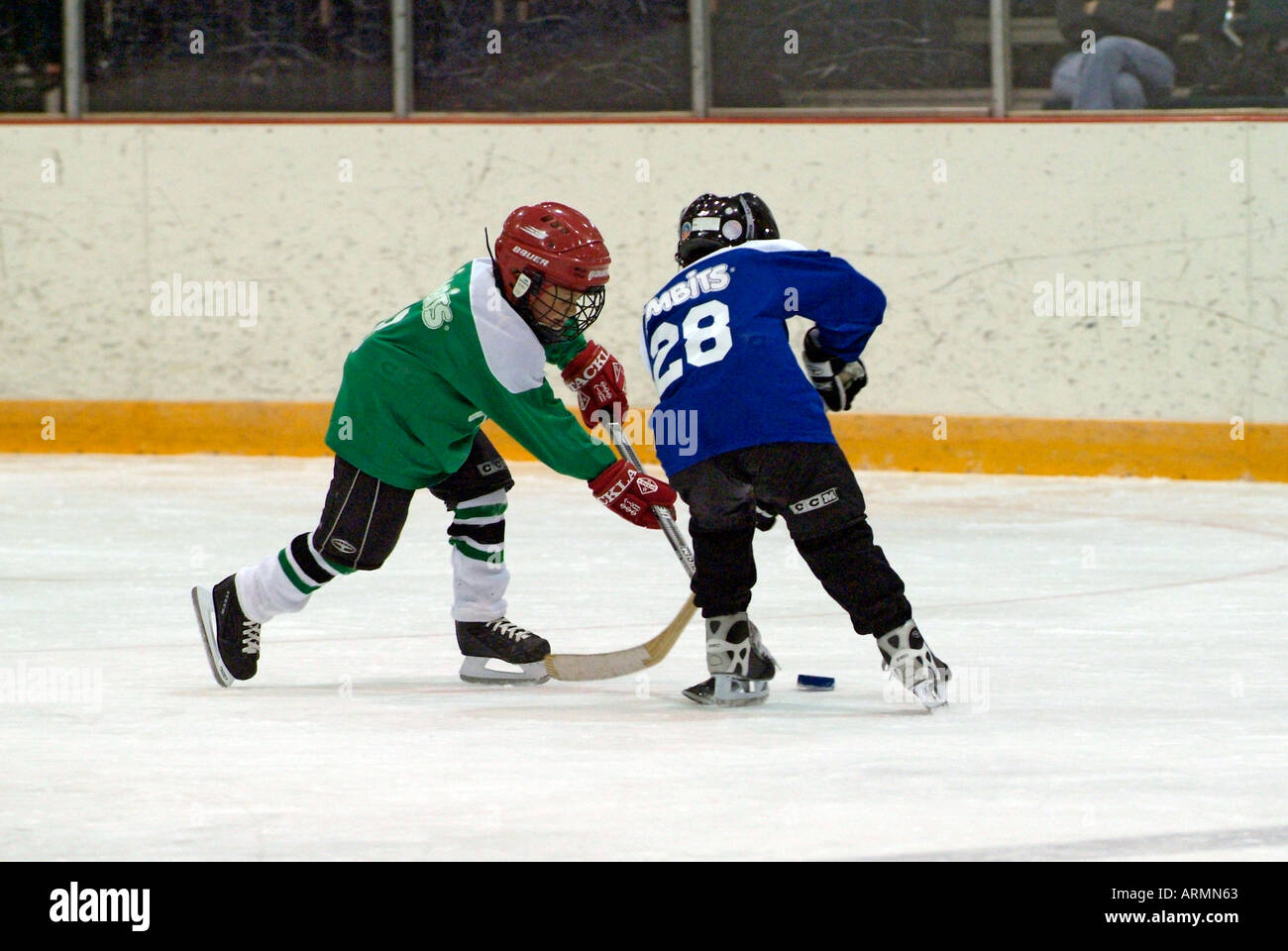 5 year old boys learn how to play the game of ice hockey Stock Photo ...