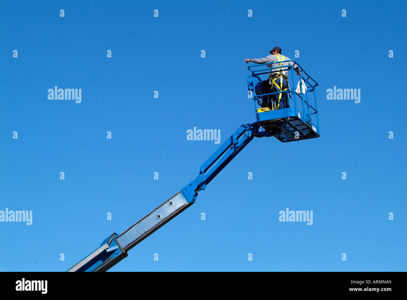 Window washers use mechanical industrial boom to elevate them against ...
