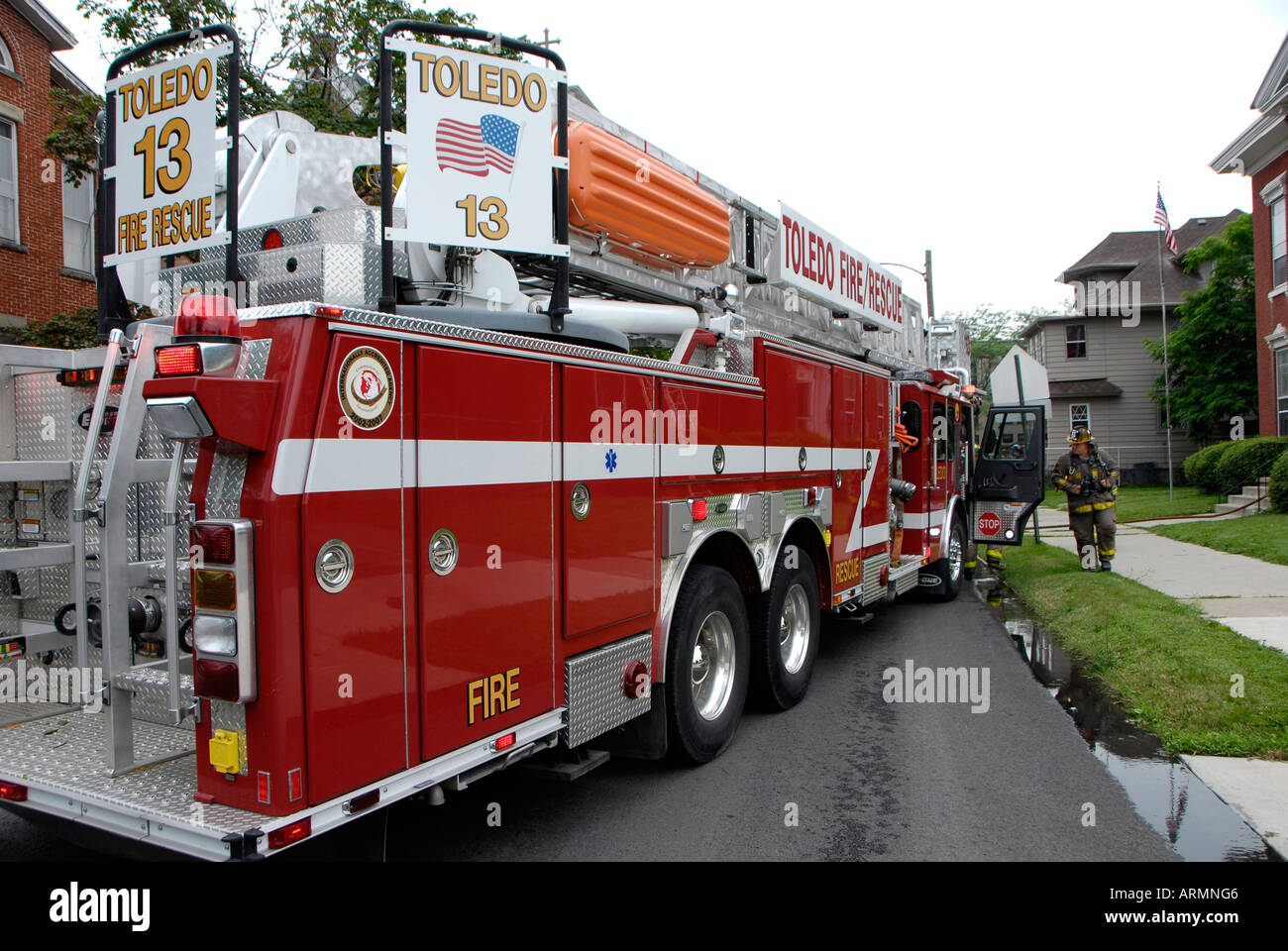 Fireman with fire fighting equipment respond to emergency fire ...