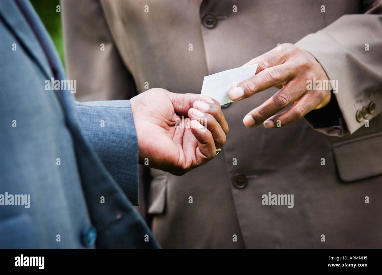 Businessmen exchanging business cards Stock Photo - Alamy