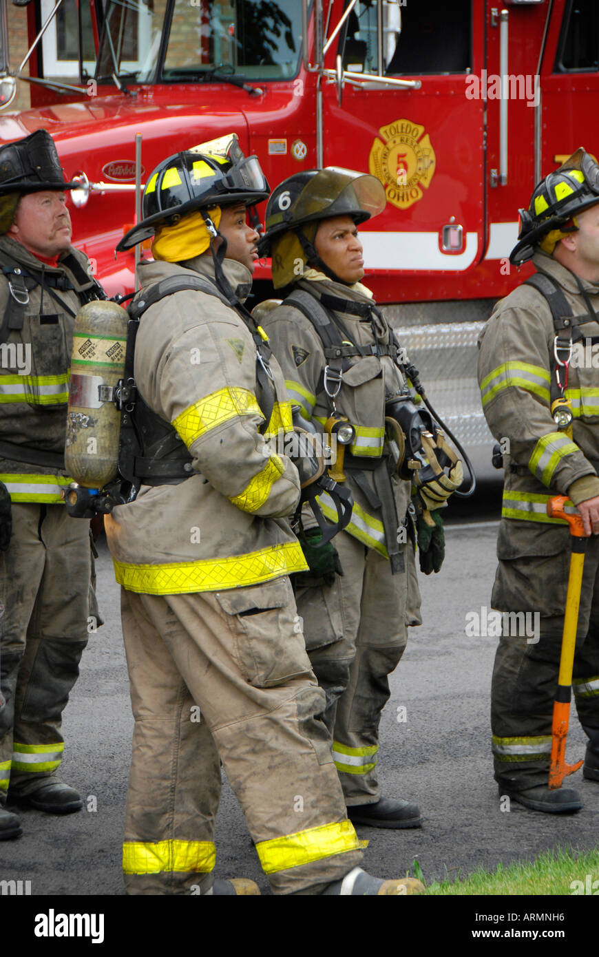 Fireman with fire fighting equipment respond to emergency fire ...