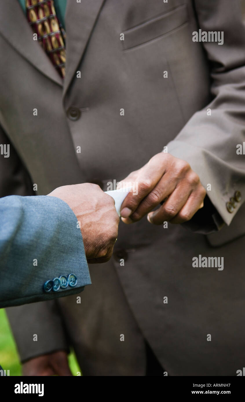 Businessmen exchanging business cards Stock Photo - Alamy