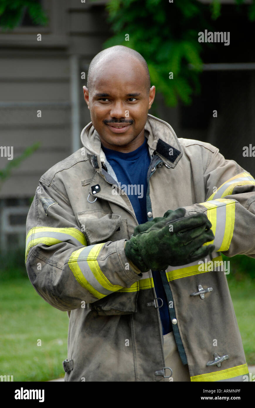 Portrait of a fireman as he responds to an emergency fire situation ...