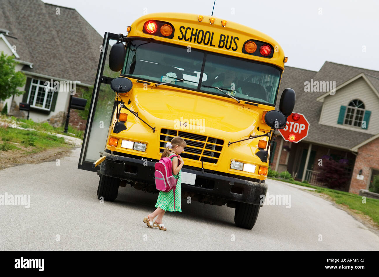 Girl getting on school bus hi-res stock photography and images - Alamy