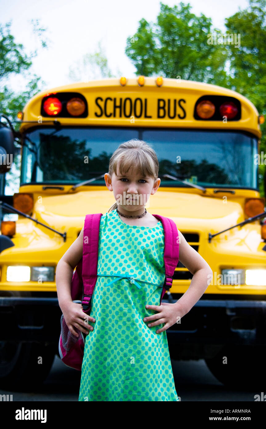 Girl getting on school bus Stock Photo - Alamy