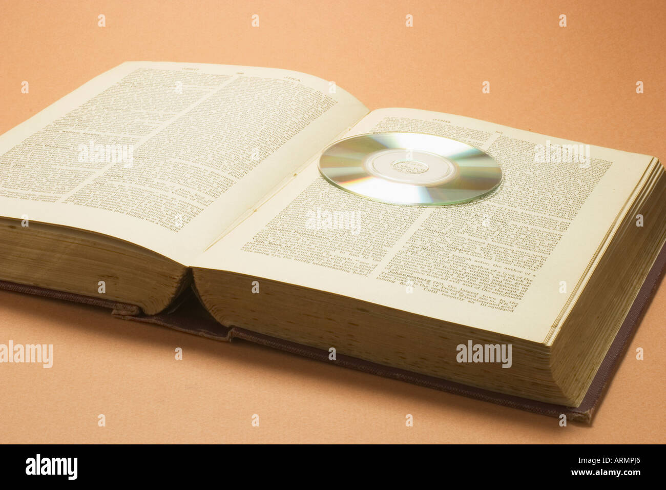 CD on Open Book Stock Photo - Alamy