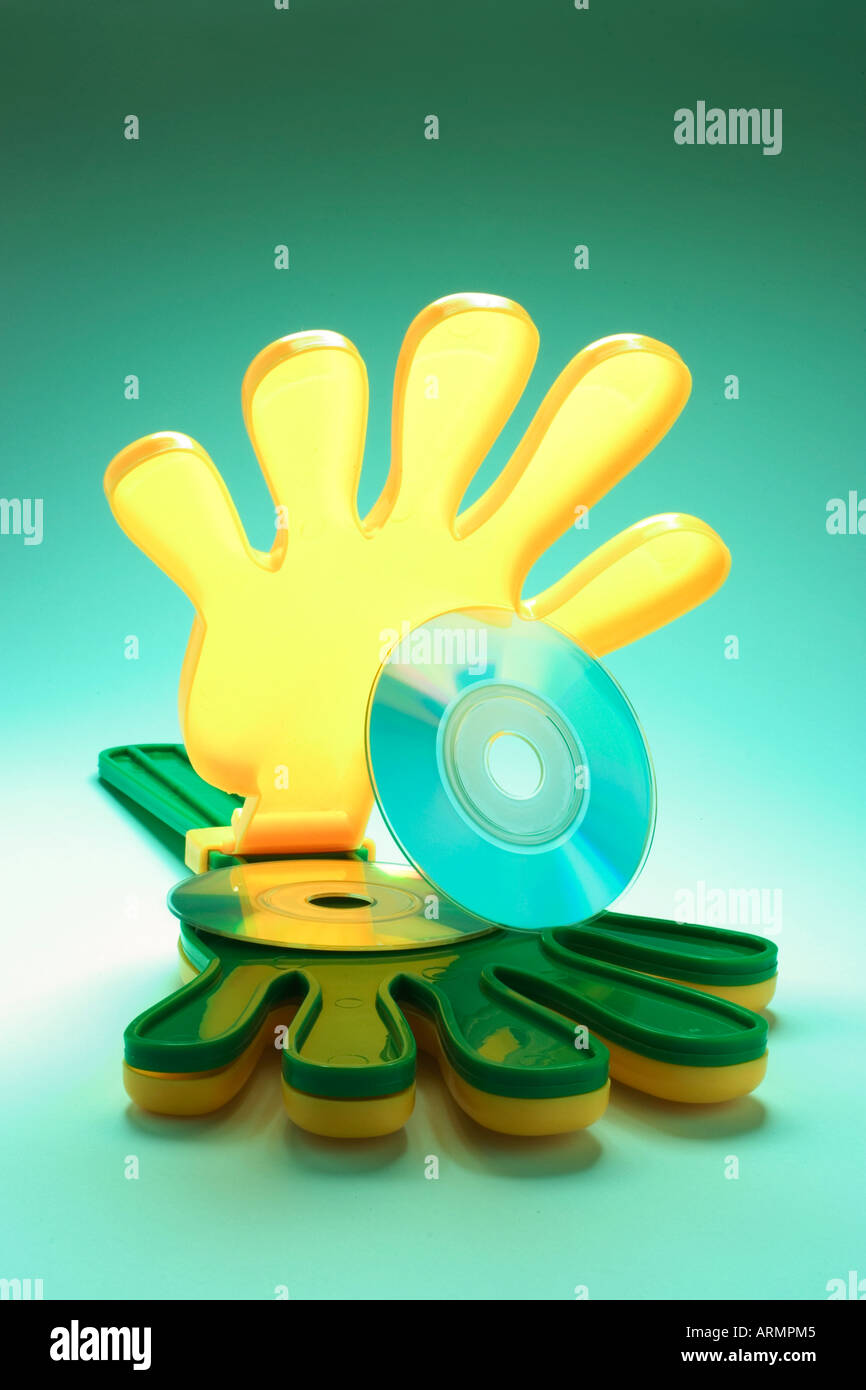 Toy Hands with CD Stock Photo - Alamy