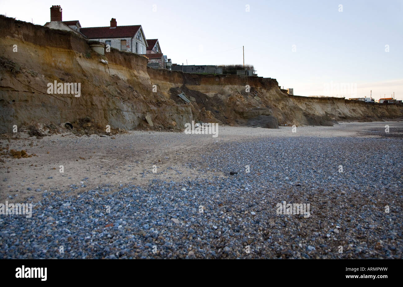 Houses on the edge Happisburgh Norfolk UK Winter Stock Photo - Alamy