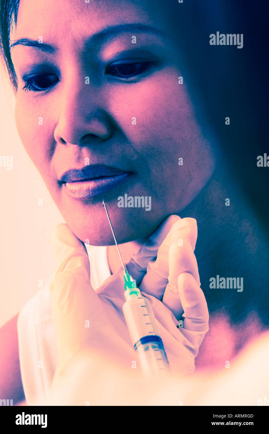 Asian woman receiving botox injection Stock Photo - Alamy