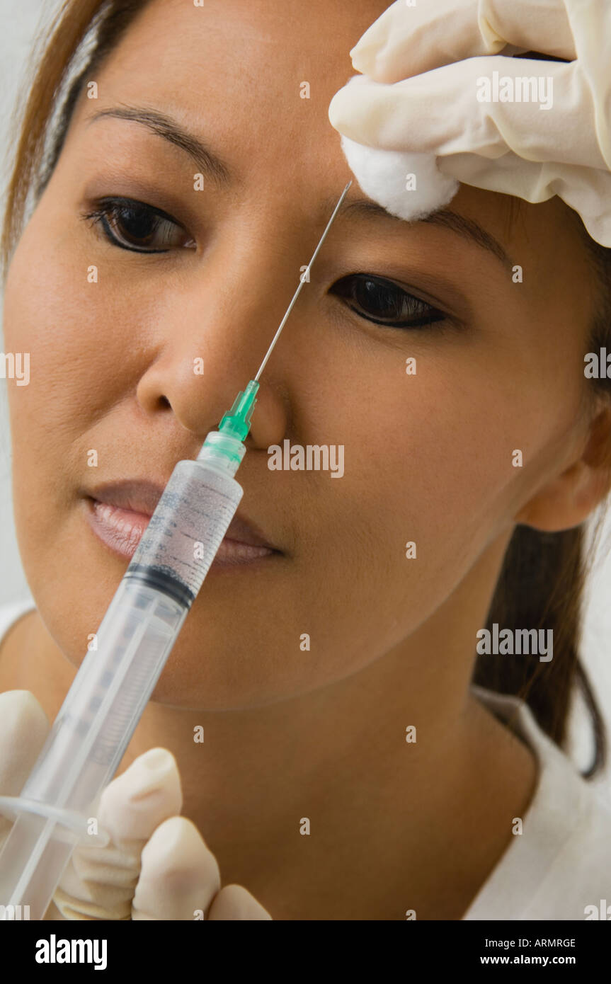 Chinese woman receiving botox injection hi-res stock photography and ...