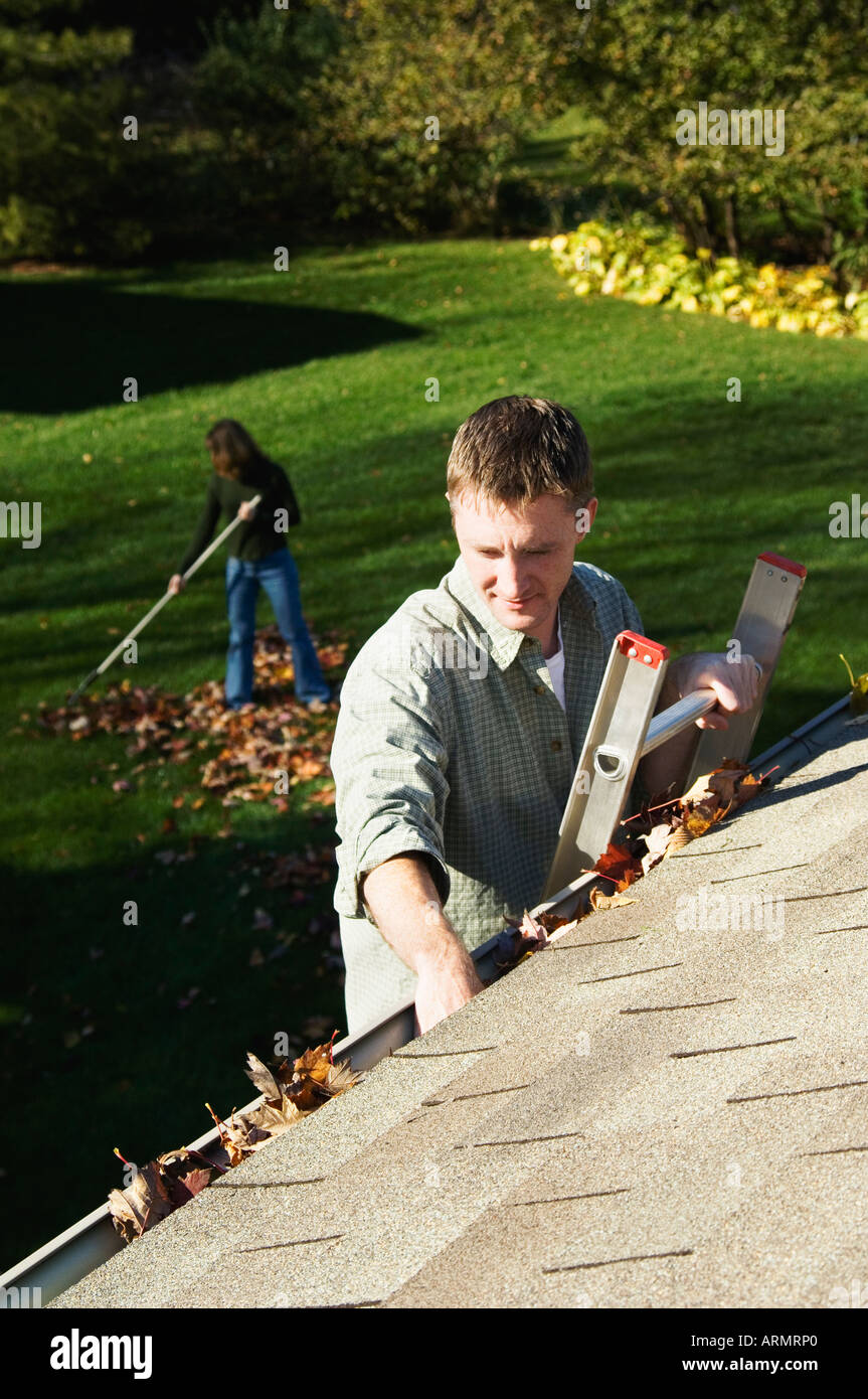 Couple doing yard work Stock Photo - Alamy
