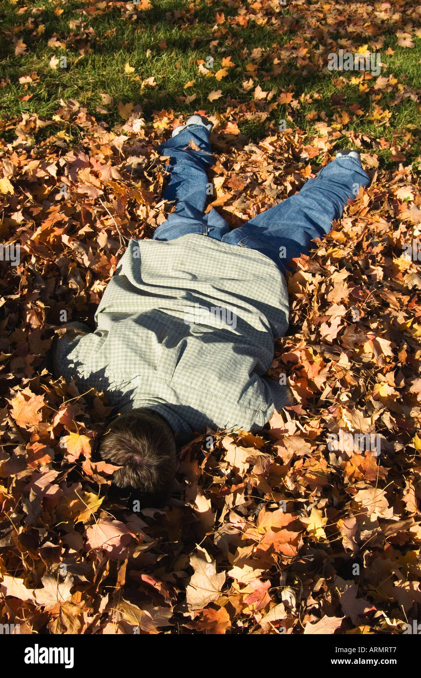 Man lying in pile hi-res stock photography and images - Alamy