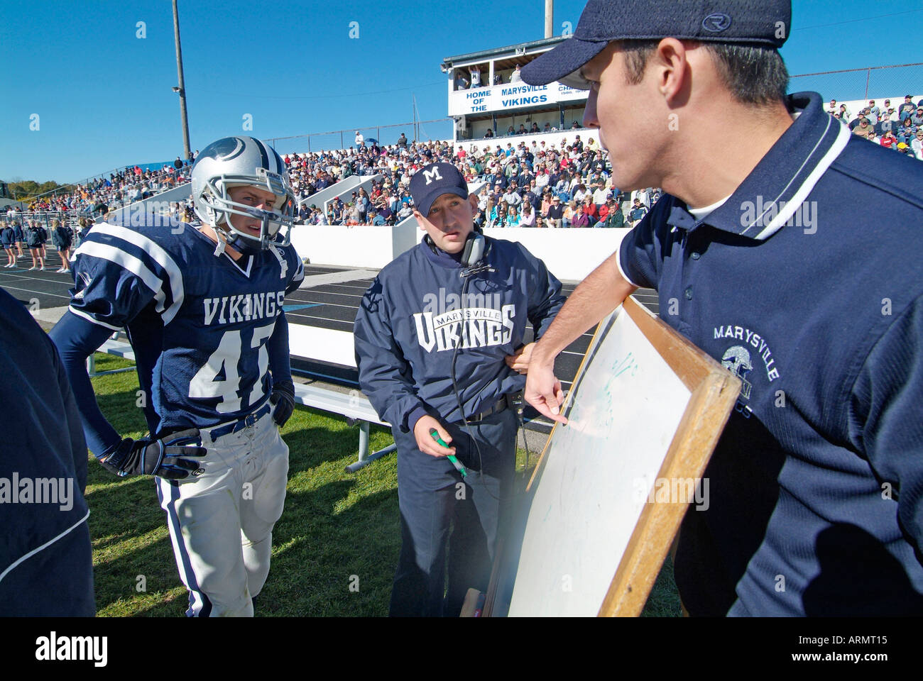 American football players giving high hi-res stock photography and ...