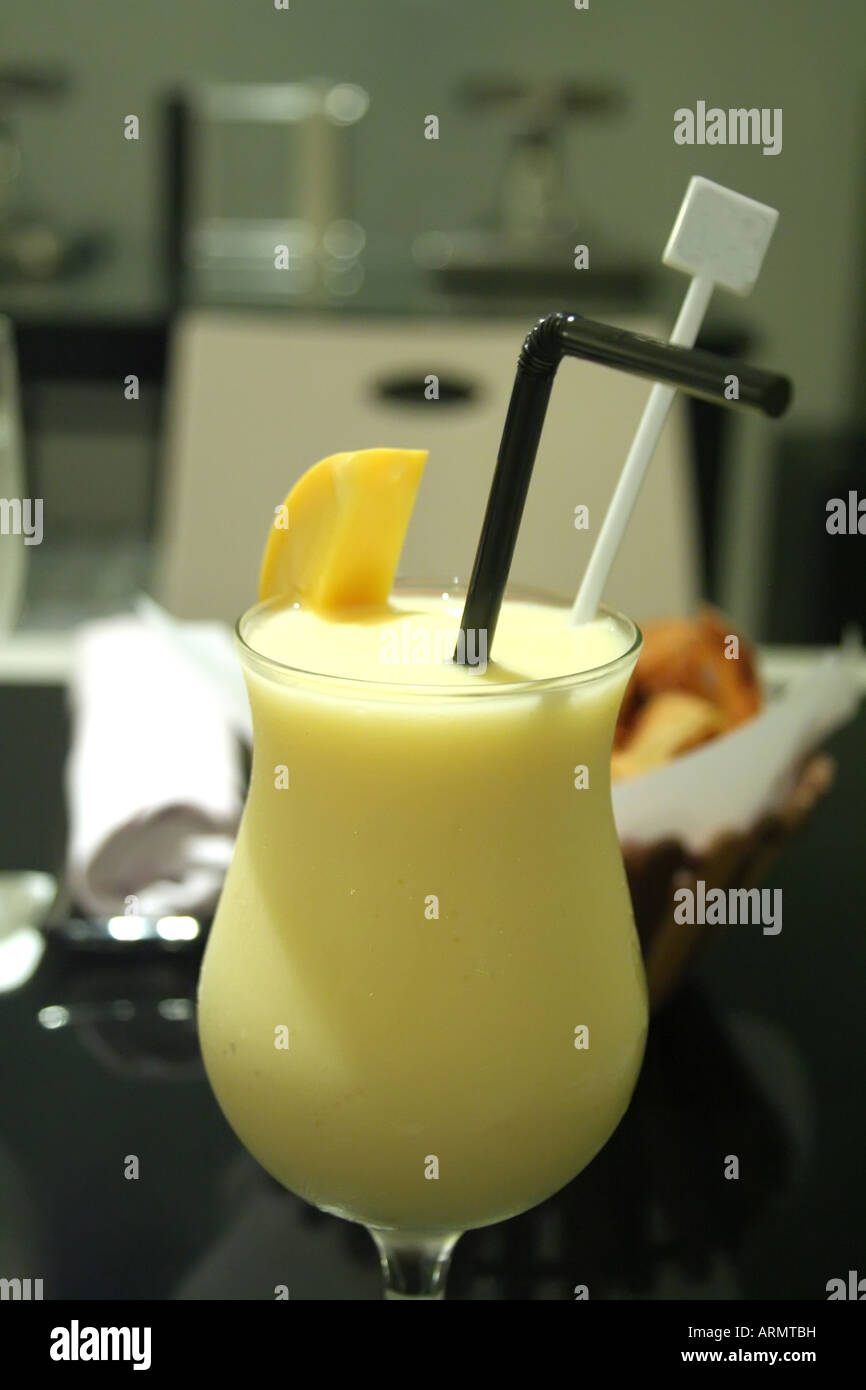 Fresh mango shake with elegant restaurant presentation Stock Photo - Alamy