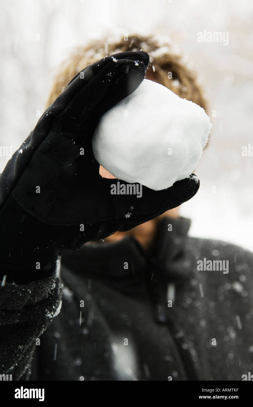 Man holding snowball Stock Photo - Alamy