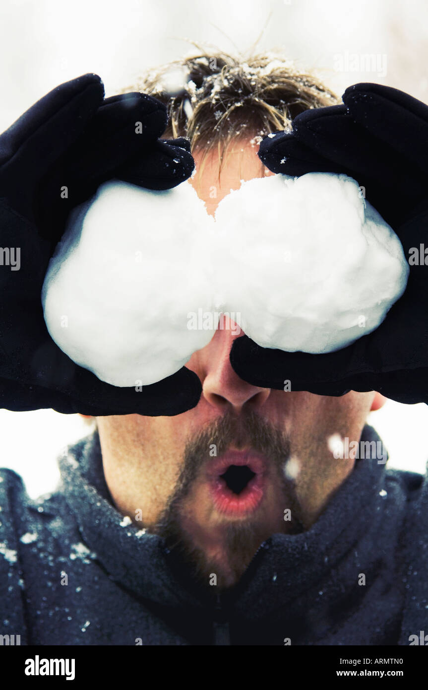 Man holding snowball Stock Photo - Alamy