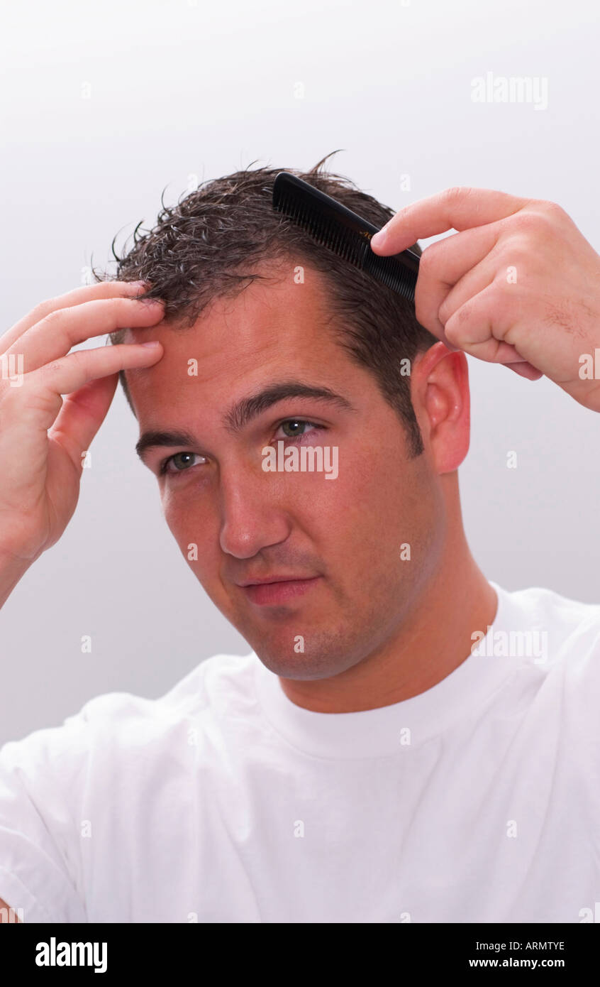 Man combing thinning hair hi-res stock photography and images - Alamy