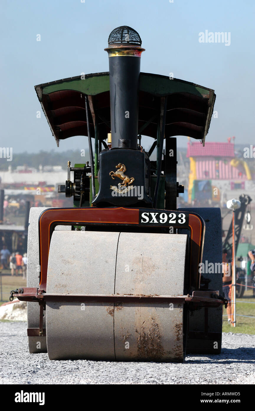 Steam roller laying roadstone at Great Dorset Steam Fair England UK GB ...