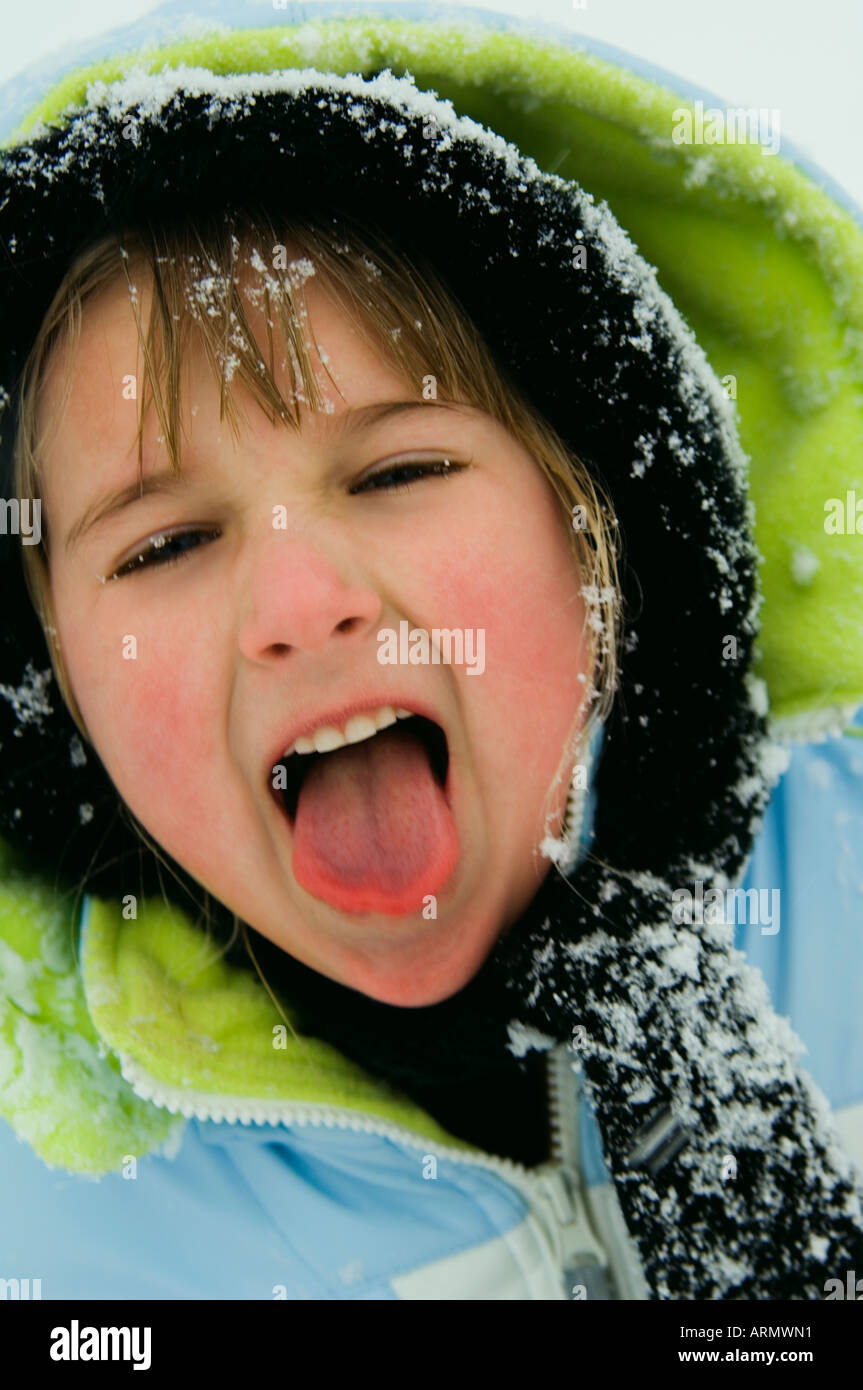 Girl catching snowflakes hi-res stock photography and images - Alamy