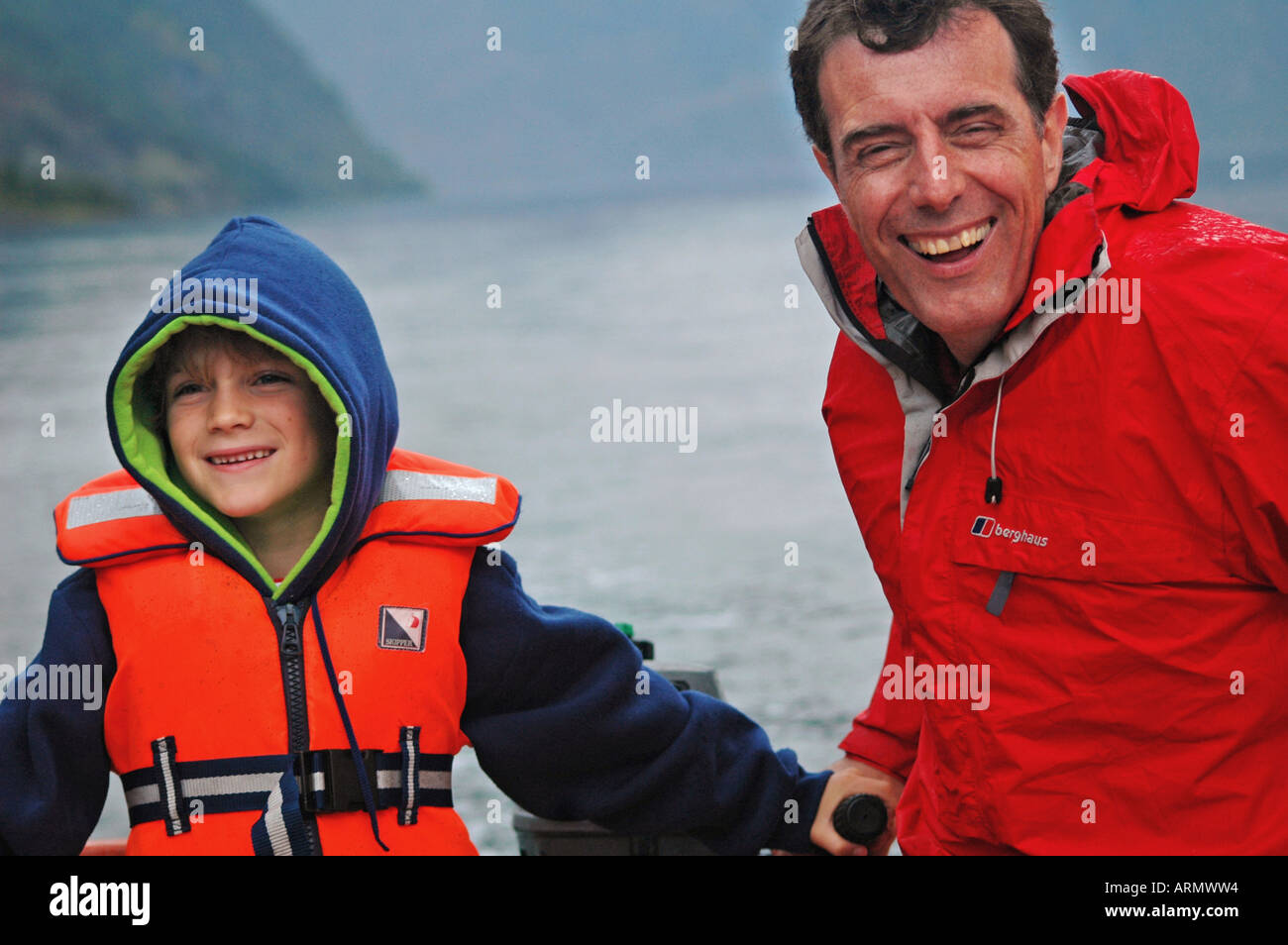 Father and son enjoying a boat ride Stock Photo - Alamy