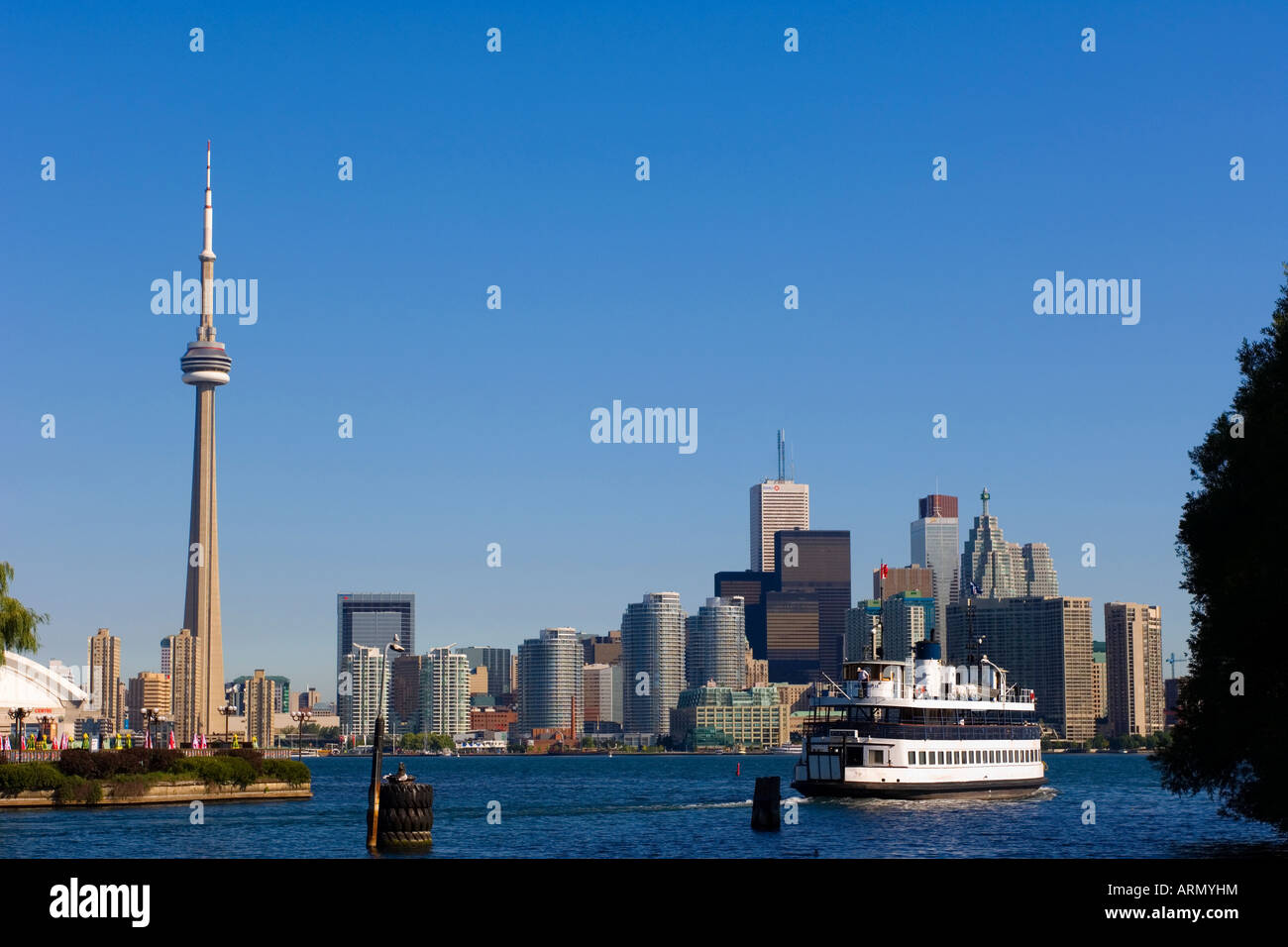 Skyline view and Ferry from across Lake Ontario from Toronto Islands of ...