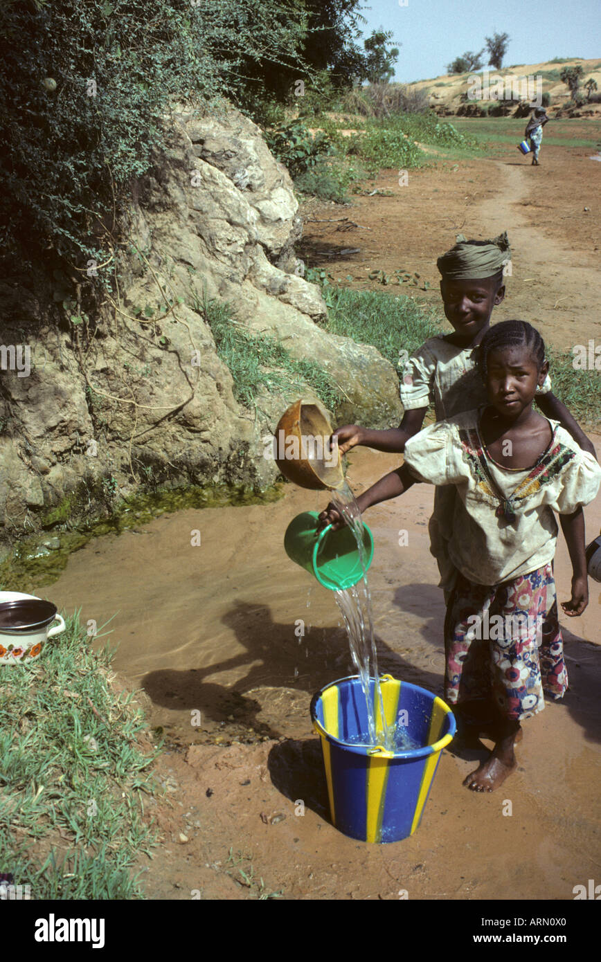 Children water africa buckets High Resolution Stock Photography and ...