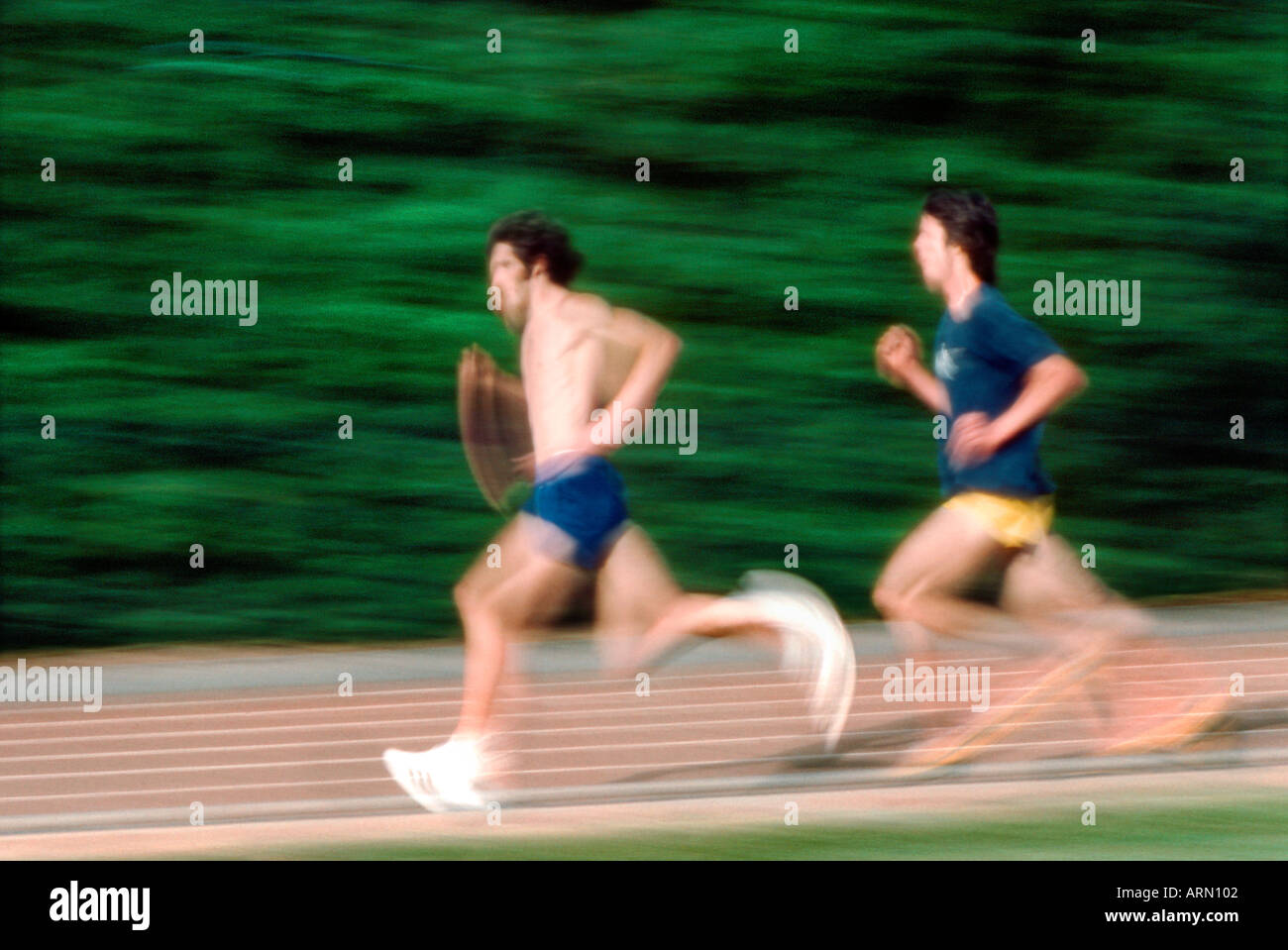 two men running track Stock Photo - Alamy