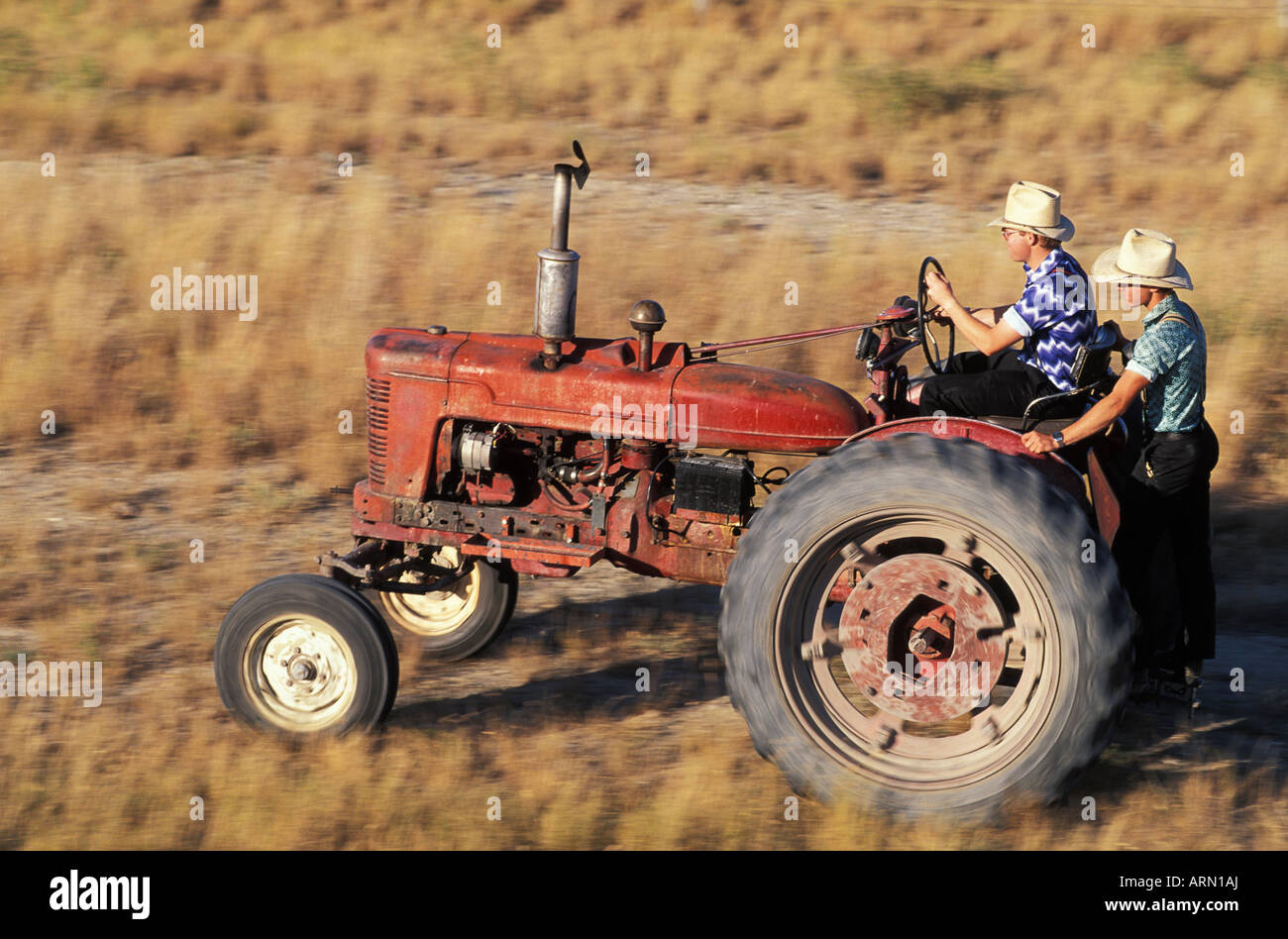 Boys riding a tractor hi-res stock photography and images - Alamy