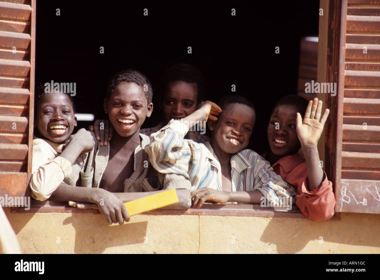 African children waving hi-res stock photography and images - Alamy