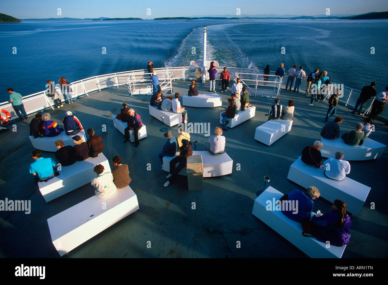 Passengers on the deck of a BC Ferry Spirit Class vessel between ...