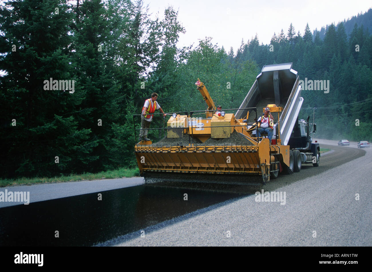 Kaslo area, paving crew resurfaces highway, British Columbia, Canada ...