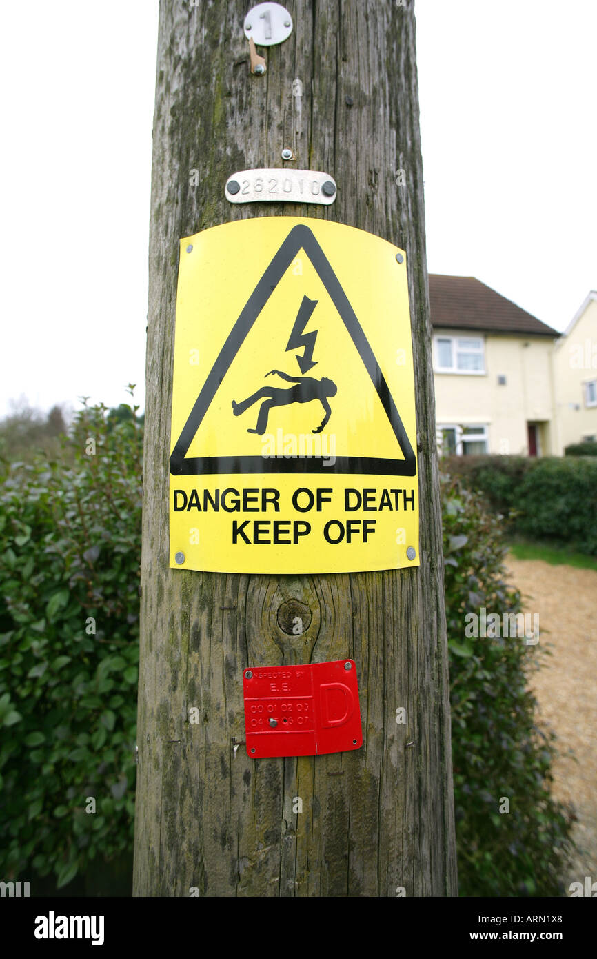Warning sign on electricity pole, England, UK Stock Photo - Alamy