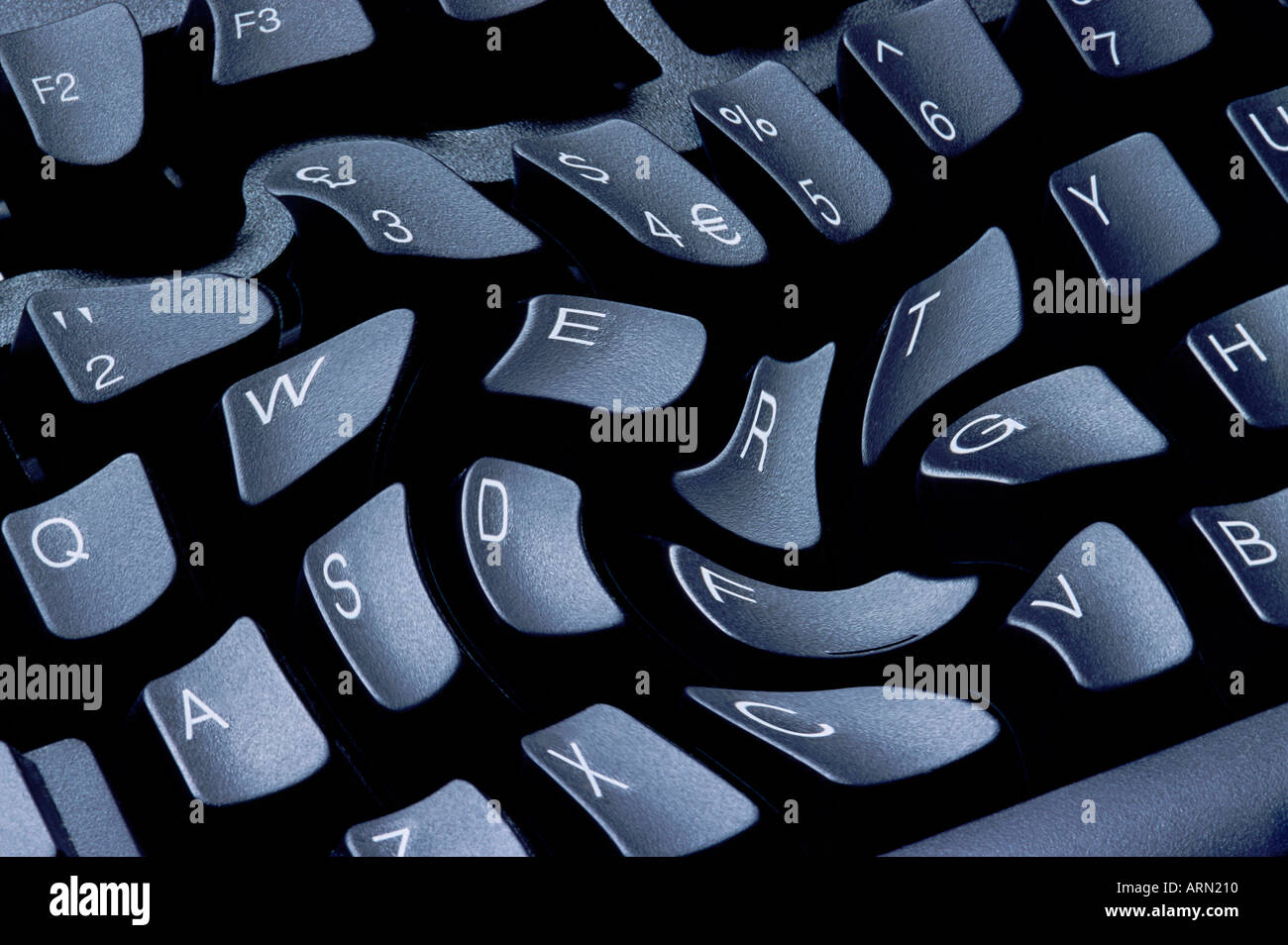 Distorted view of part of PC keyboard showing QWERTY and neighbouring ...