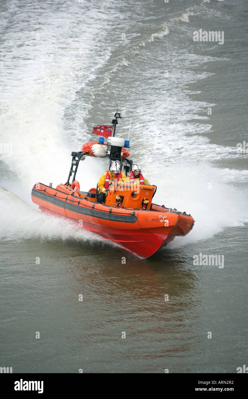 RNLI launch en route to a rescue, River Thames, London, England, UK ...