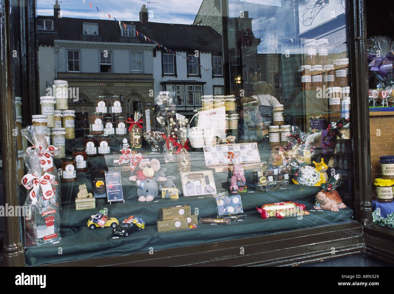 Delicatessen shop window in Keswick lit by daylight various foods on ...