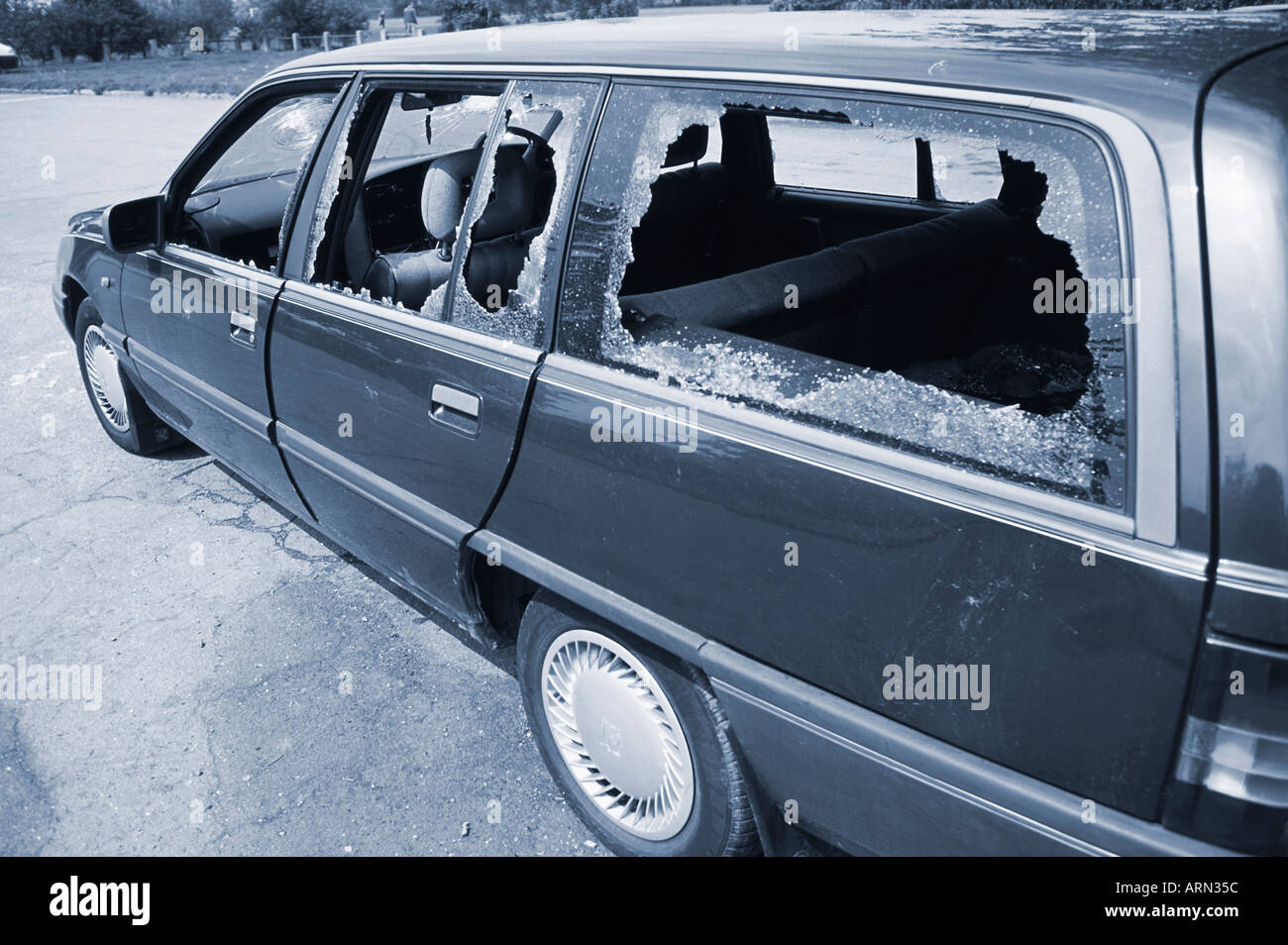 Vandalised car with smashed windows monochrome blue black version Stock ...