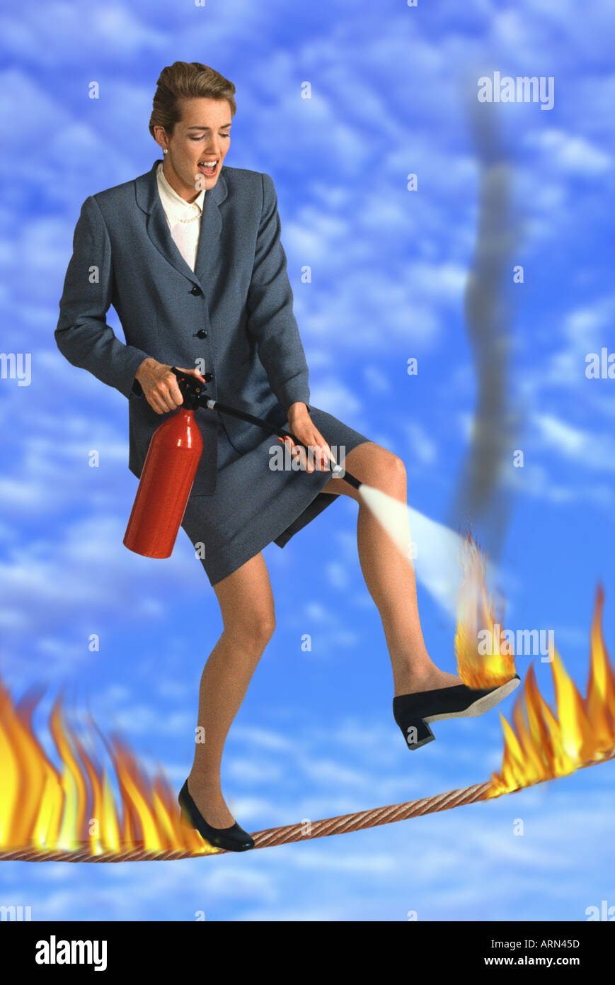 Woman extinguishing fire hi-res stock photography and images - Alamy