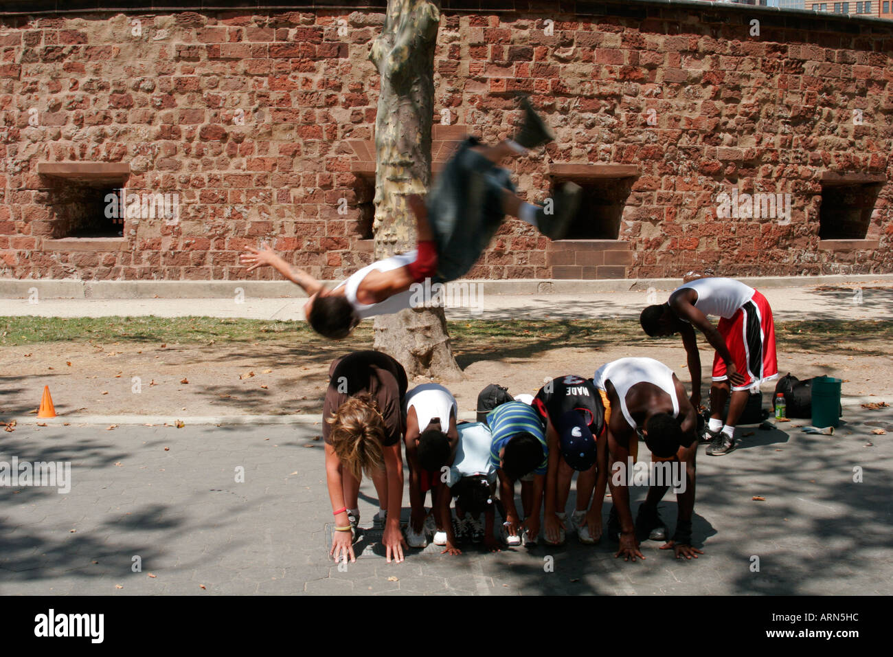 Children jumping in air in park hi-res stock photography and images - Alamy